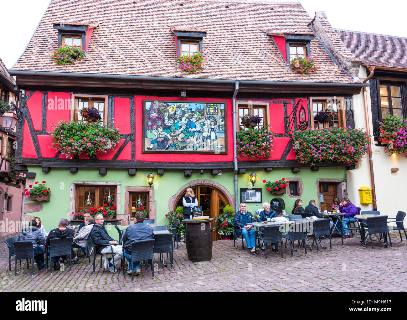 Traditional restaurant in the medieval town of Riquewihr, Alsatian Wine ...