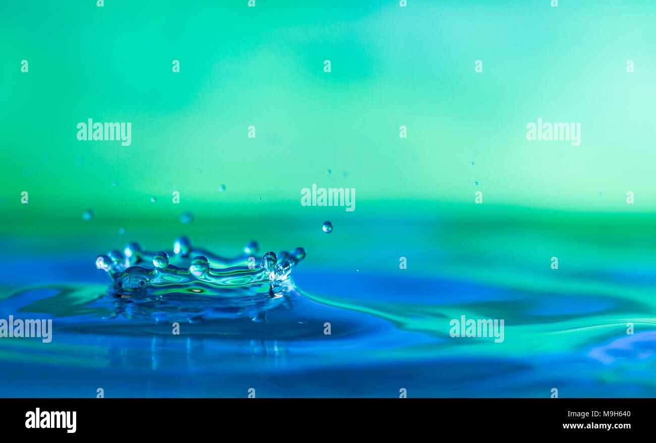 colorful water splash in a pond Stock Photo - Alamy