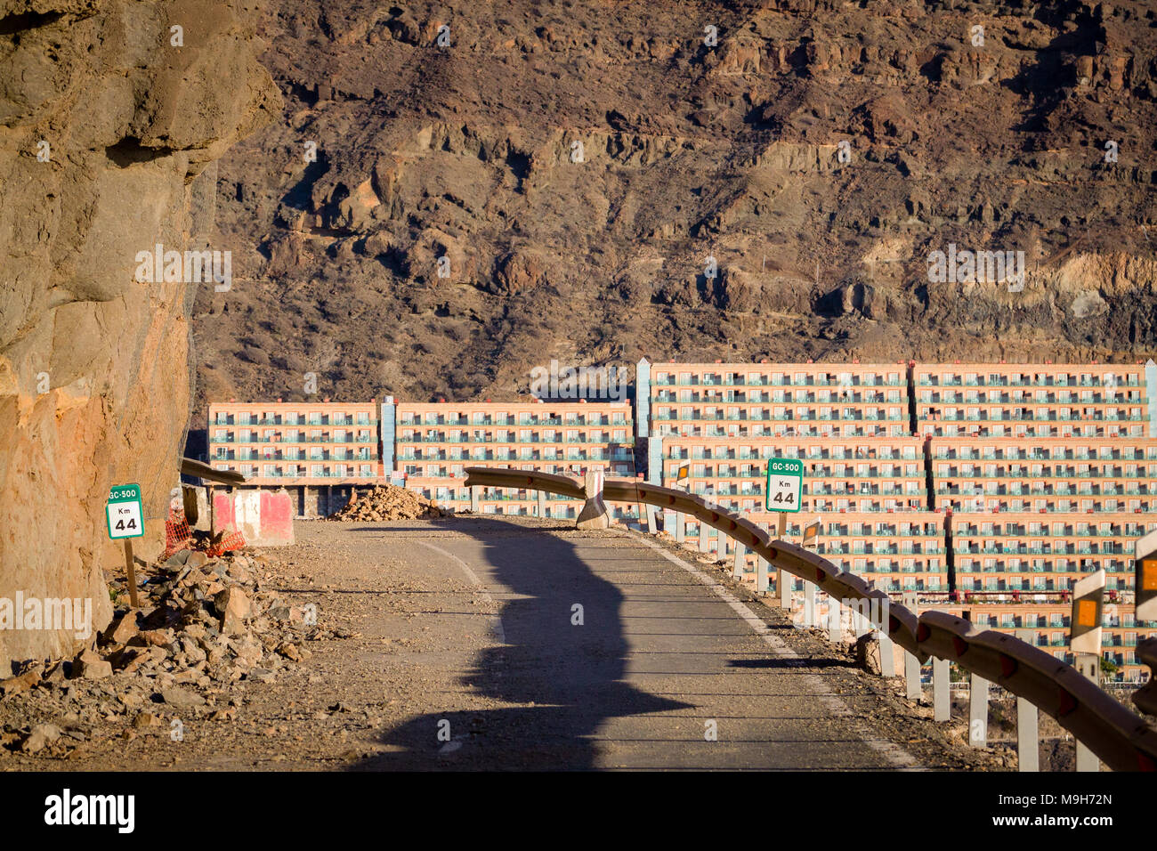 Falling rocks and big collapse hole on closed mountain road Stock Photo ...