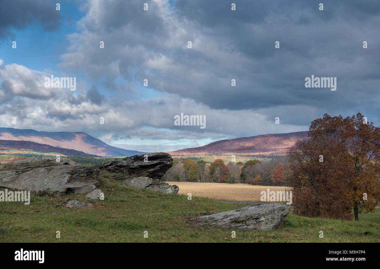 sunny country landscape with rock outcrop Stock Photo - Alamy