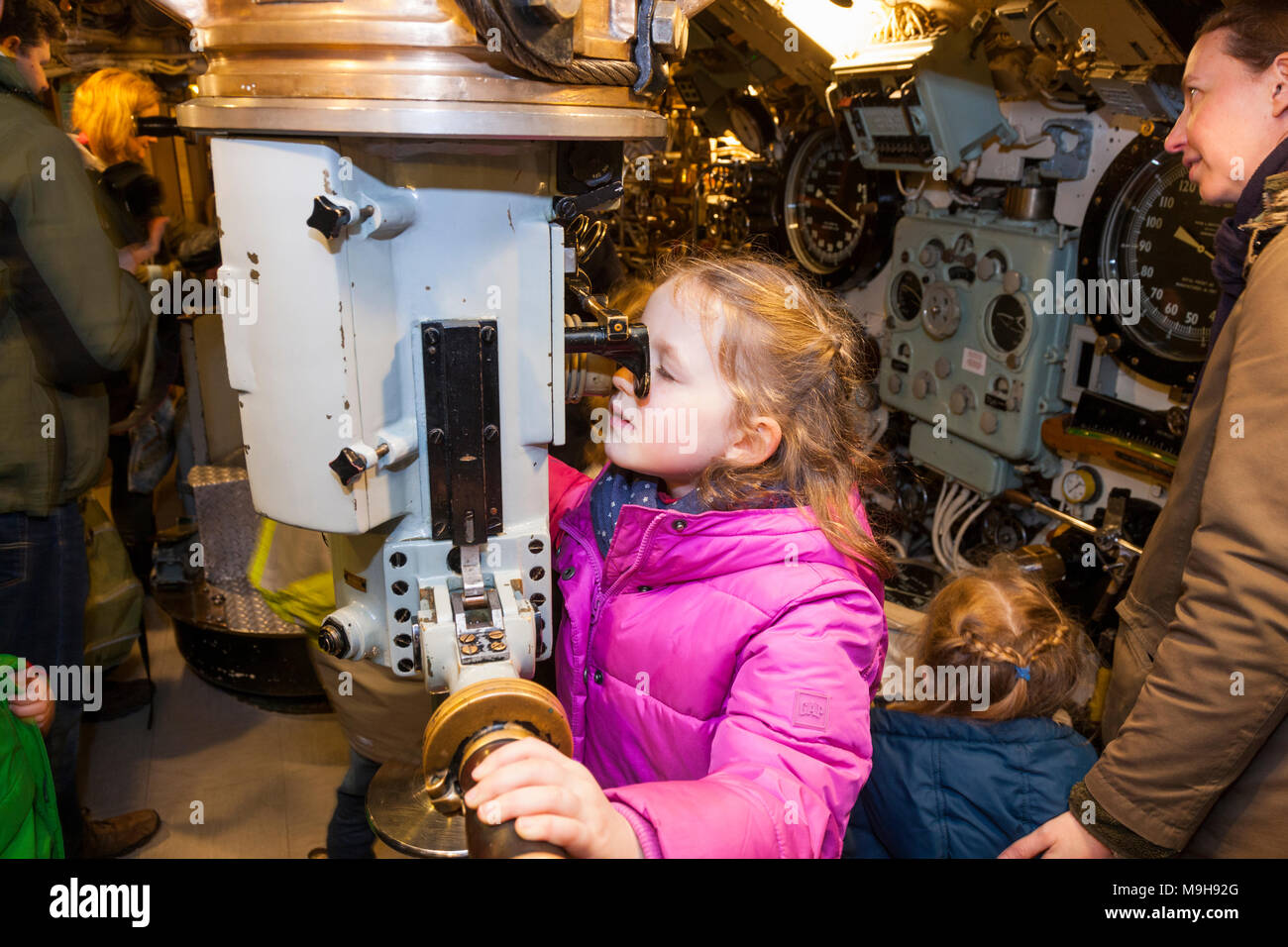 Child / kid / girl looking through periscope & interior / inside ...