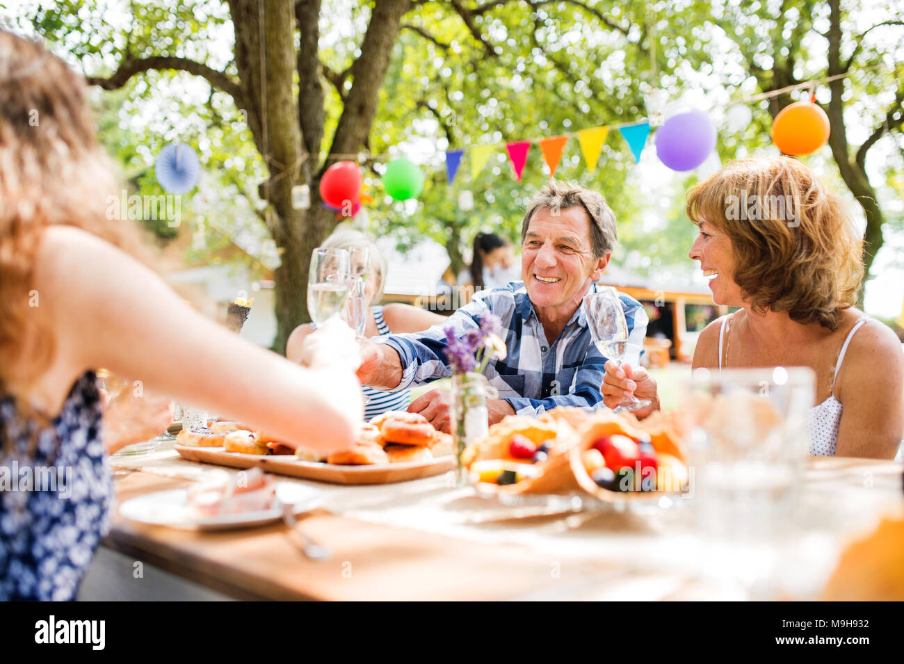 Family celebration outside in the backyard. Big garden party Stock ...