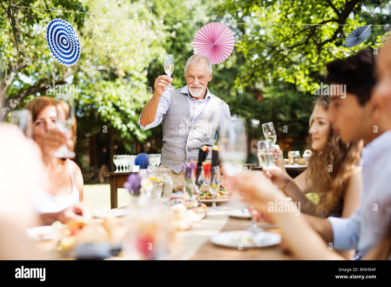 Family celebration outside in the backyard. Big garden party Stock ...