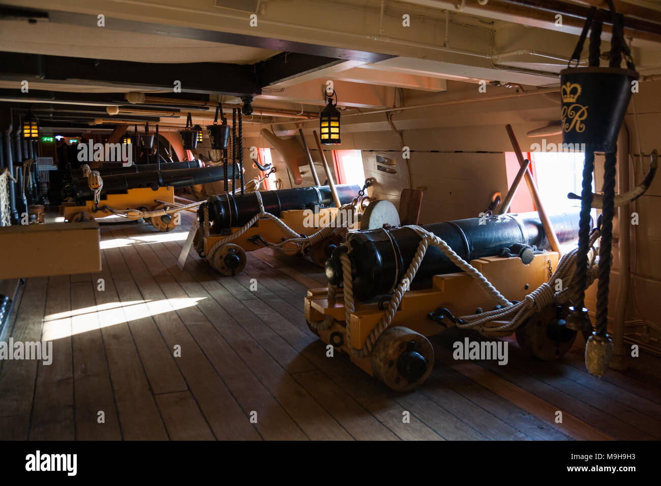 Gun deck & gun ports, with muzzle loading cannons, of Admiral Lord ...