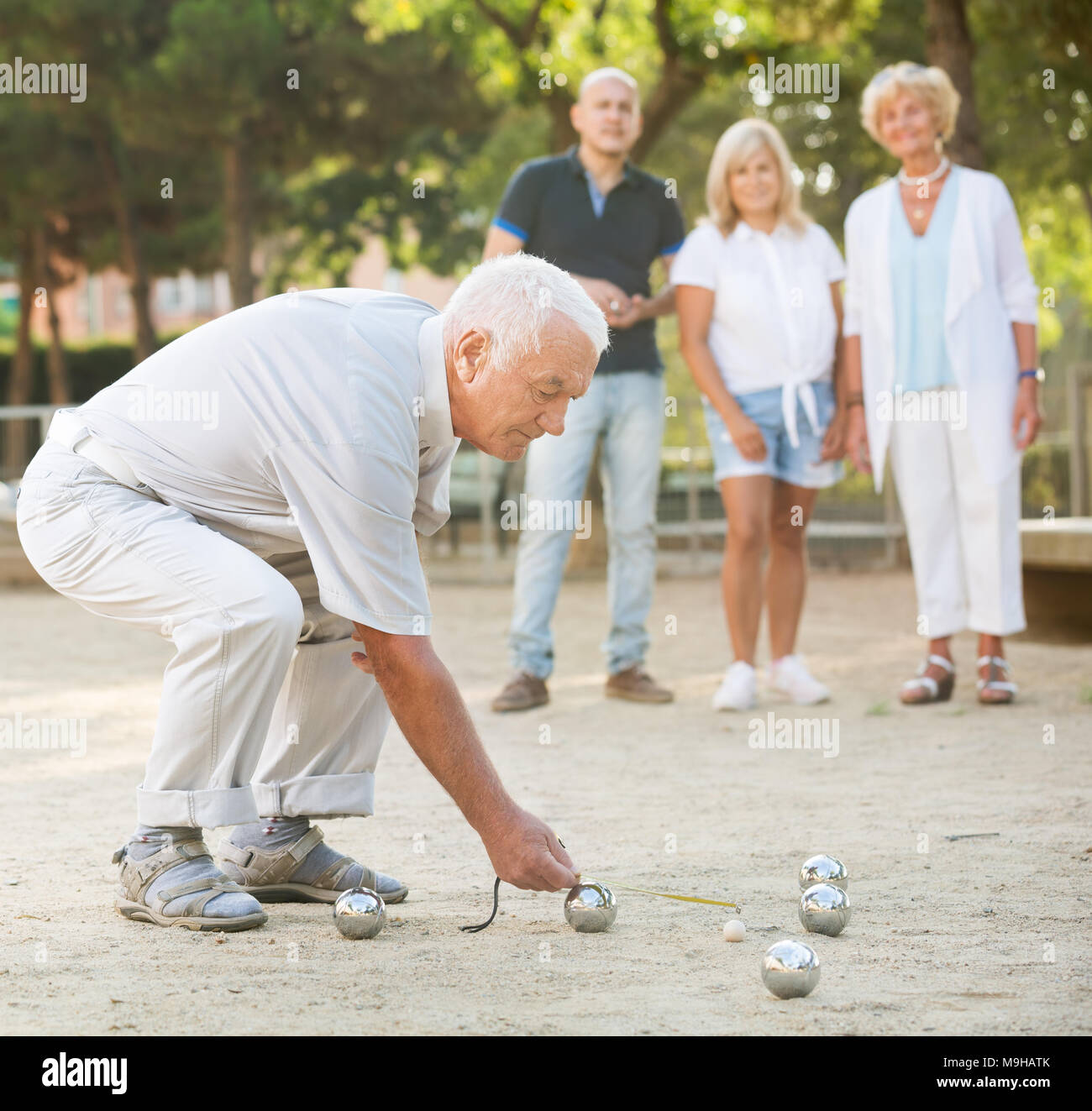 Playing bocce ball in park hi-res stock photography and images - Alamy