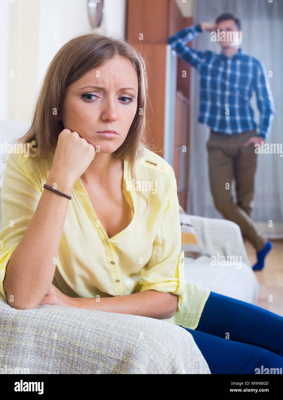 Upset man and frustrated girl having bad argument indoors Stock Photo ...