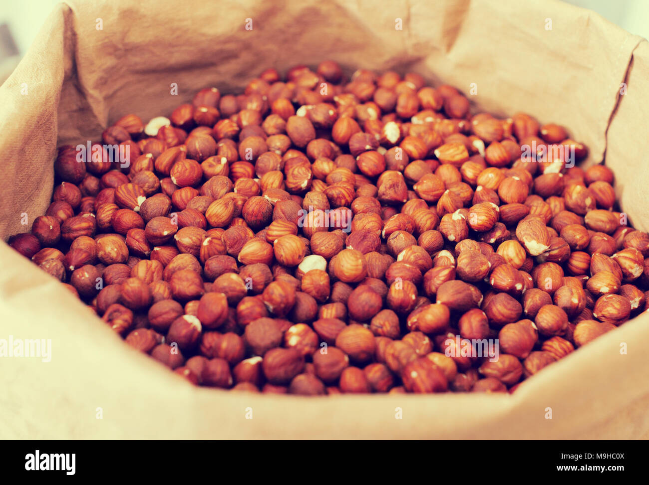 Image of hazelnut in container in the store Stock Photo - Alamy