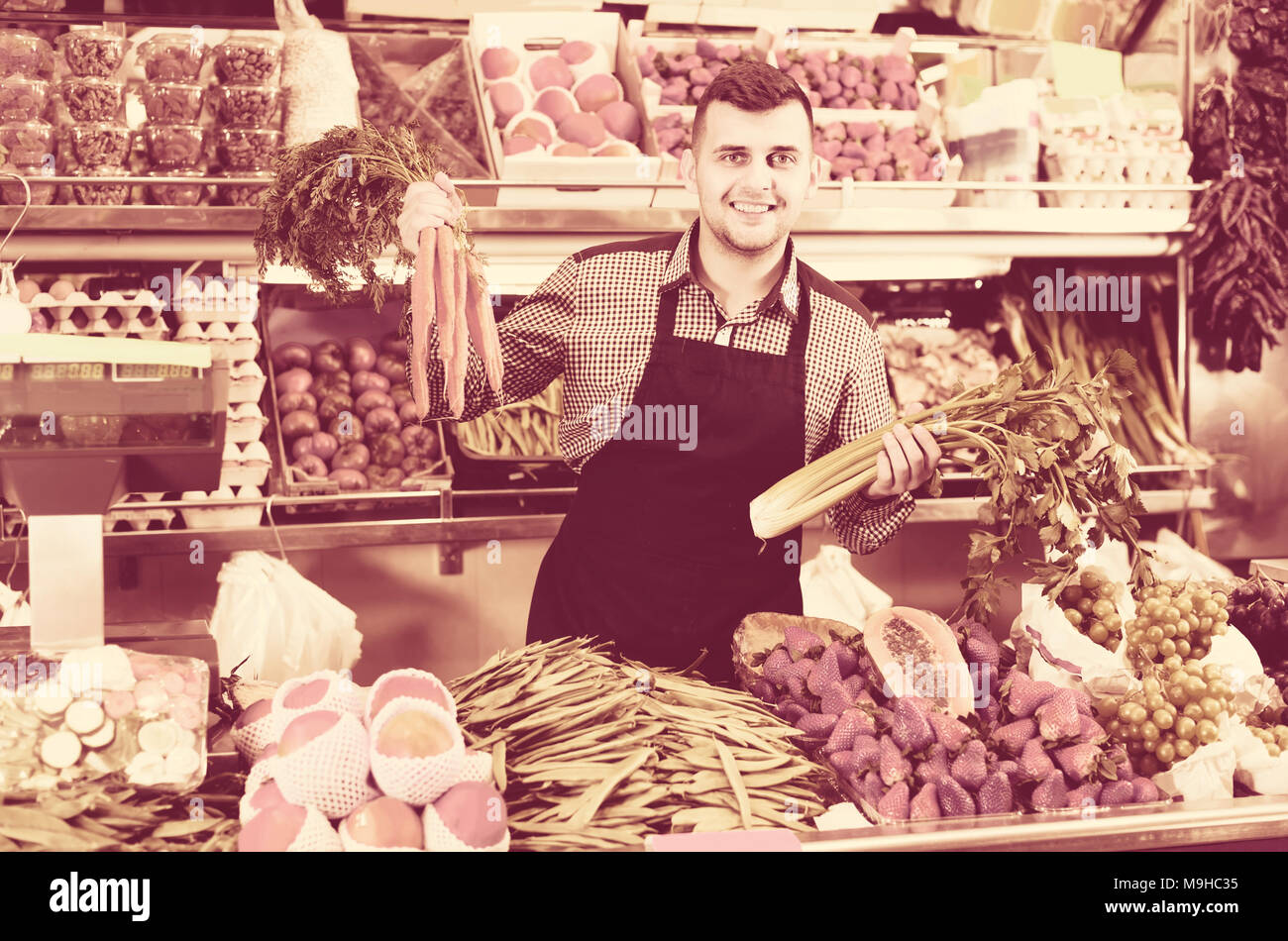 happy american male shopping assistant demonstrating assortment of ...