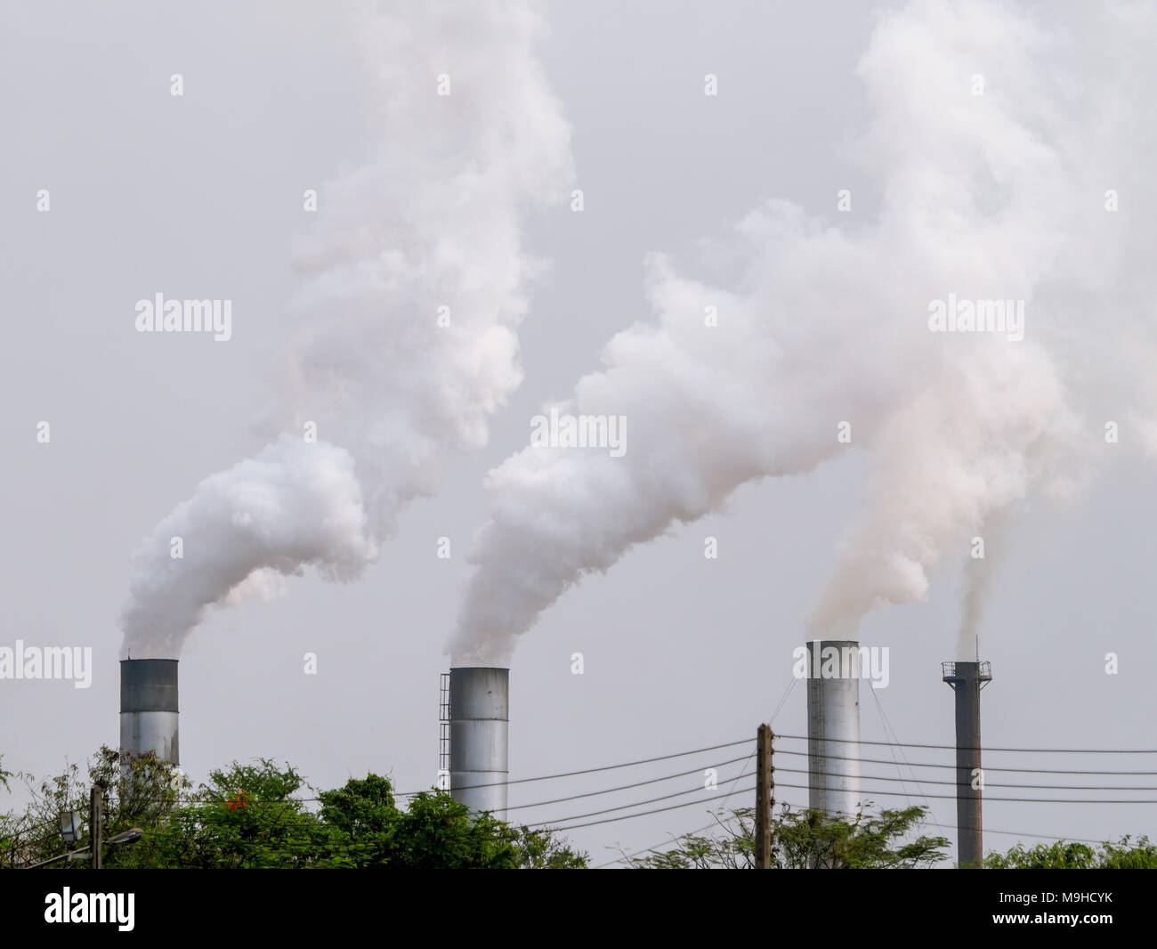 Factory chimney pipe with smoke Stock Photo - Alamy