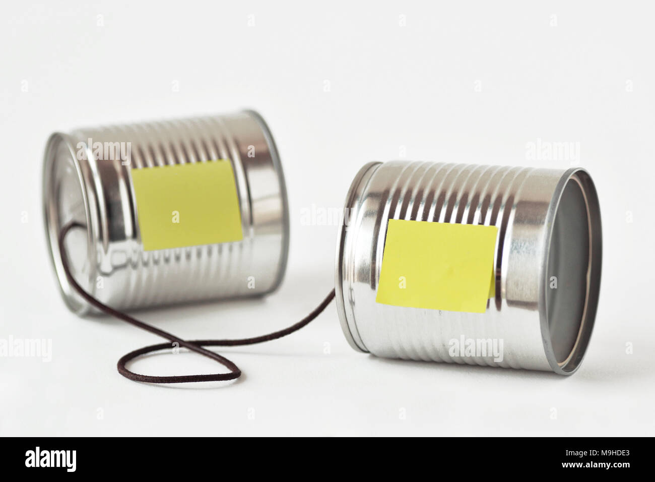 Tin can telephone hi-res stock photography and images - Alamy