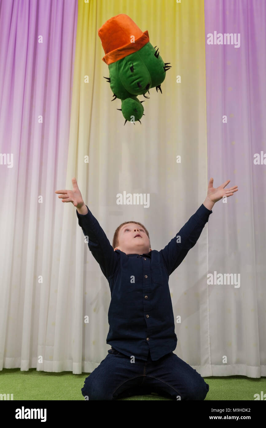 Boy with cactus Stock Photo - Alamy