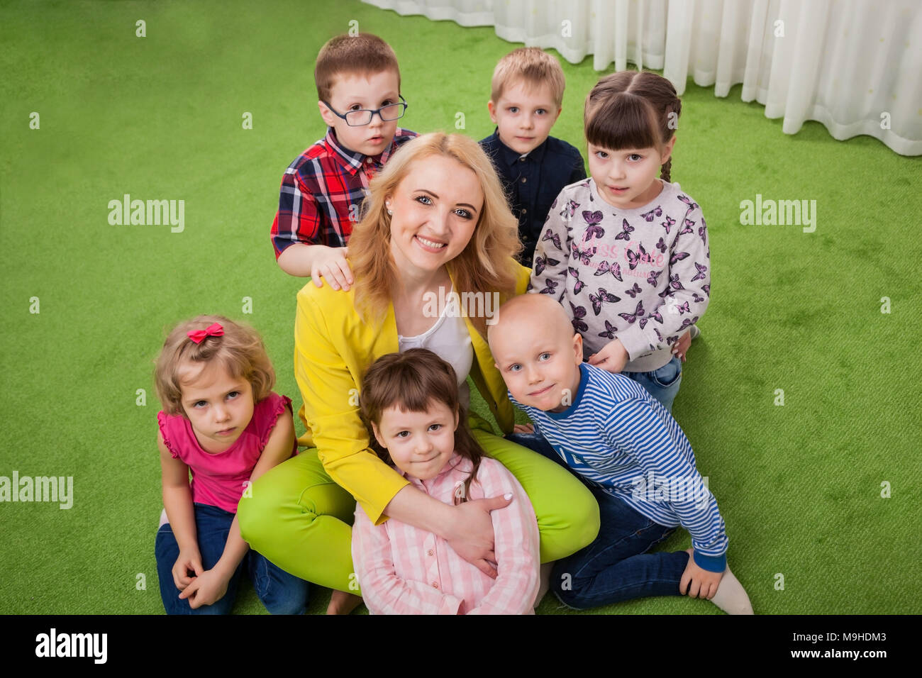 Preschool teacher child hugging hi-res stock photography and images - Alamy