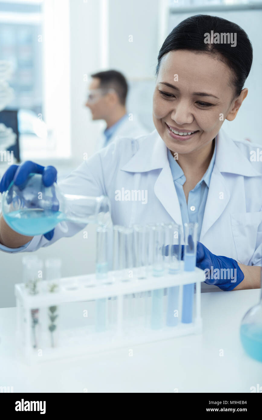 Joyful scientist making an important experiment Stock Photo - Alamy