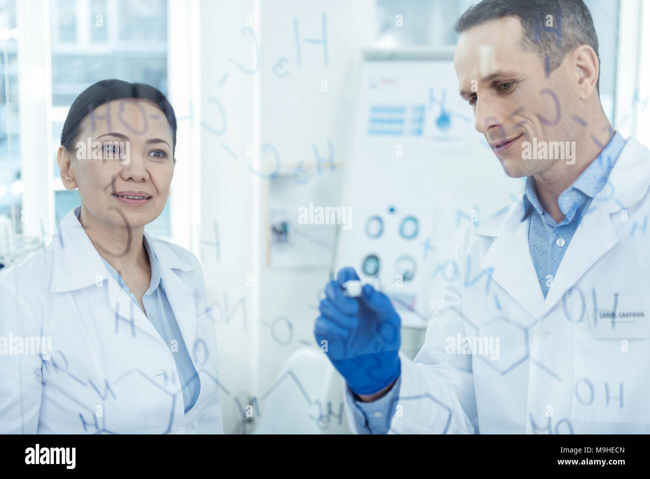 Inspired scientists working on their research Stock Photo - Alamy