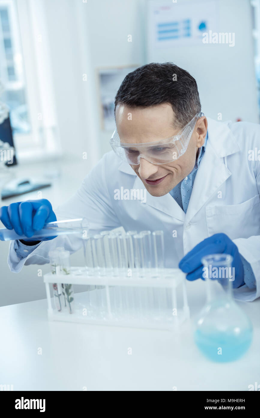 Concentrated microbiologists working in a lab Stock Photo - Alamy