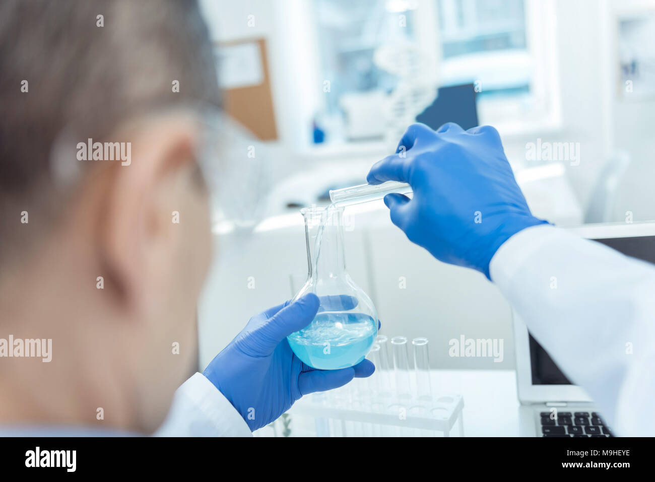 Professional scientist making an experiment Stock Photo - Alamy