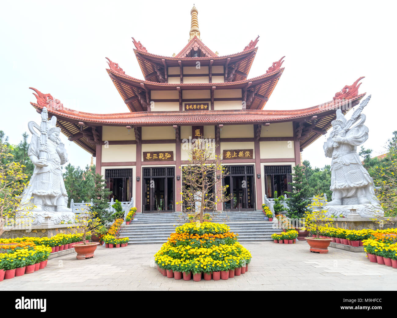 Architecture temple in morning lunar new year decorated flowers front ...