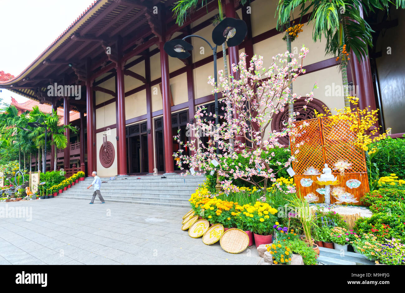 Architecture temple in morning lunar new year decorated flowers front ...