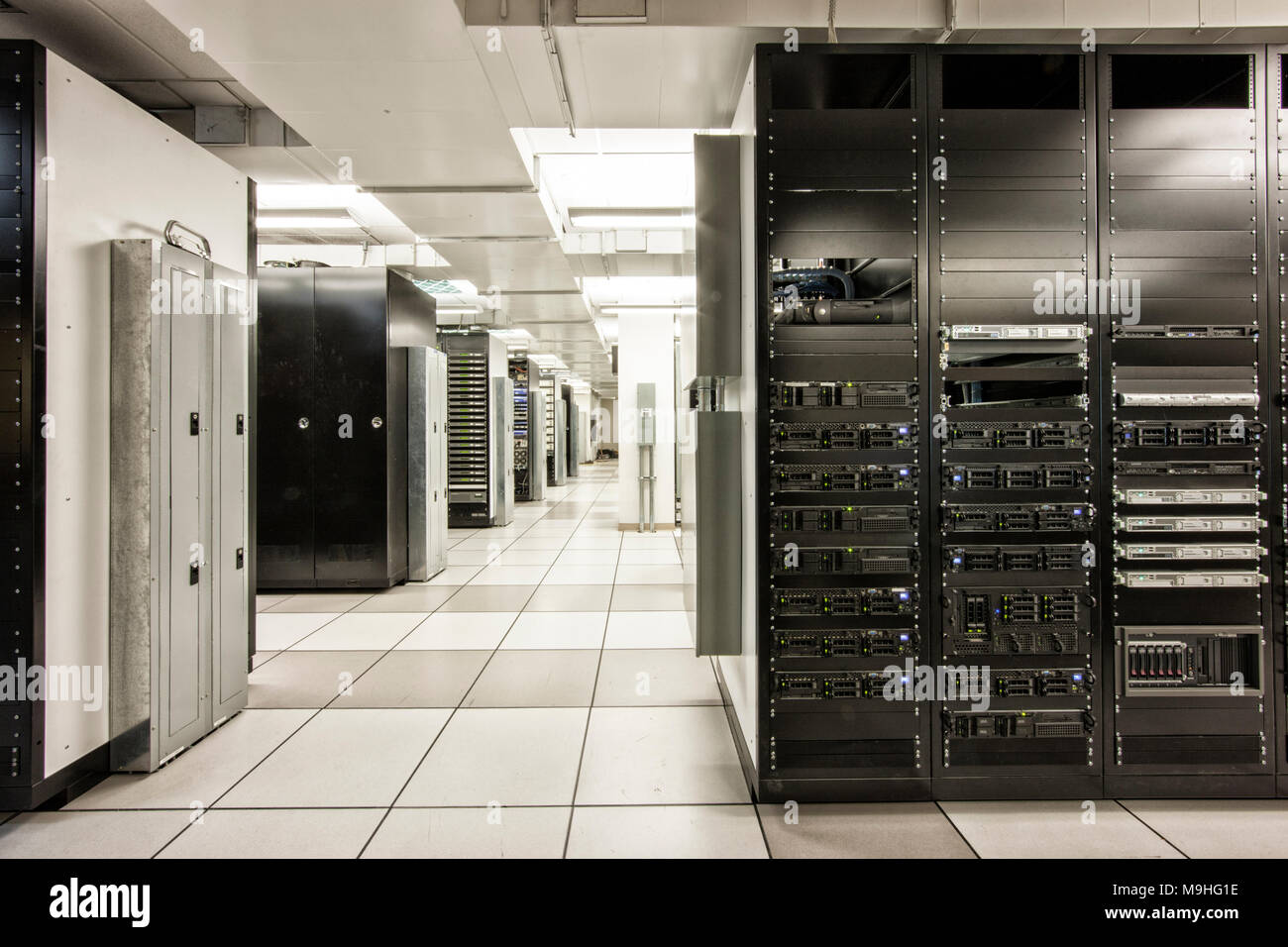 Storage racks aligned in a computer server room Stock Photo - Alamy