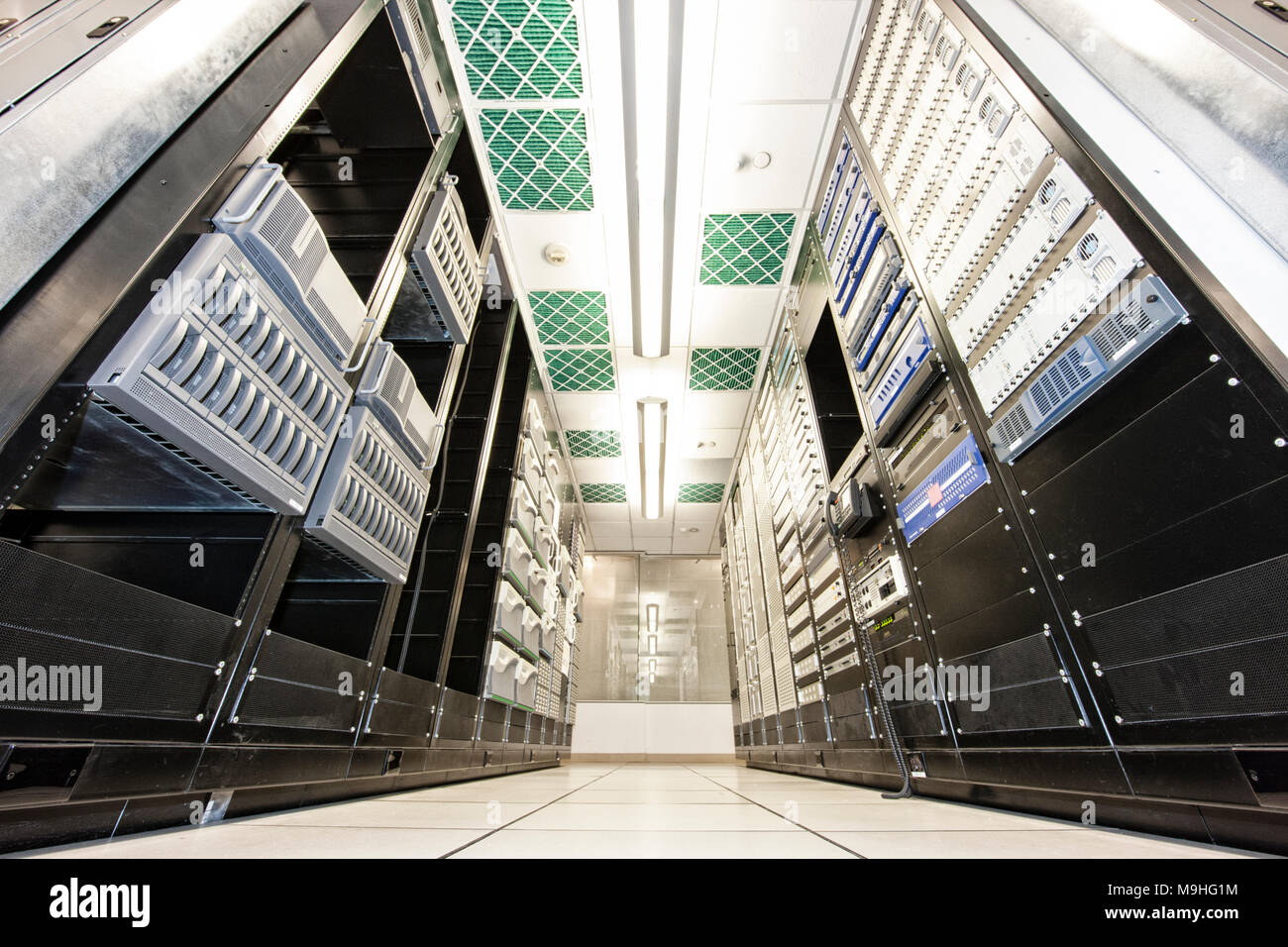 Storage racks aligned in a computer server room Stock Photo - Alamy