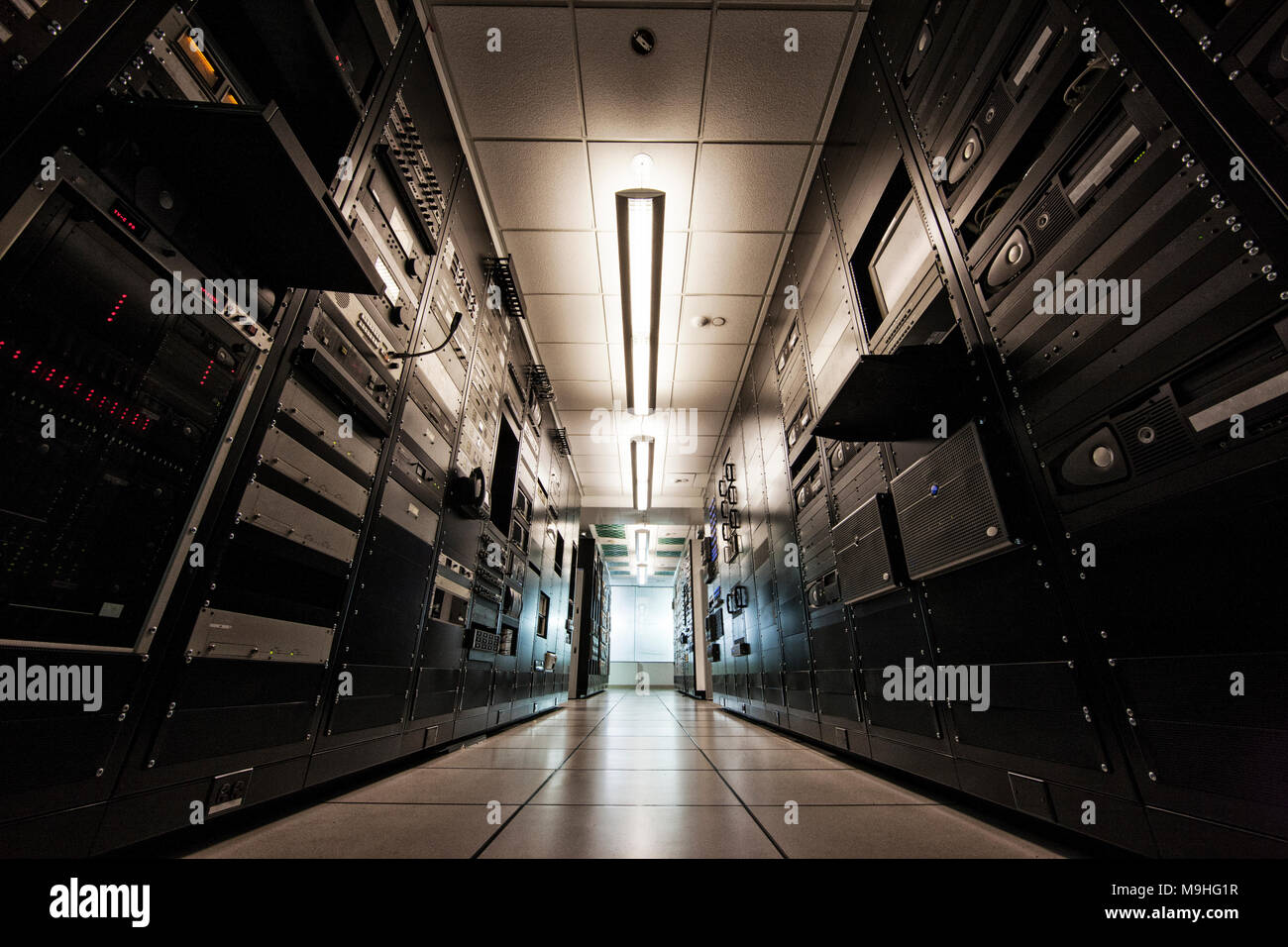 Storage racks aligned in a computer server room Stock Photo - Alamy