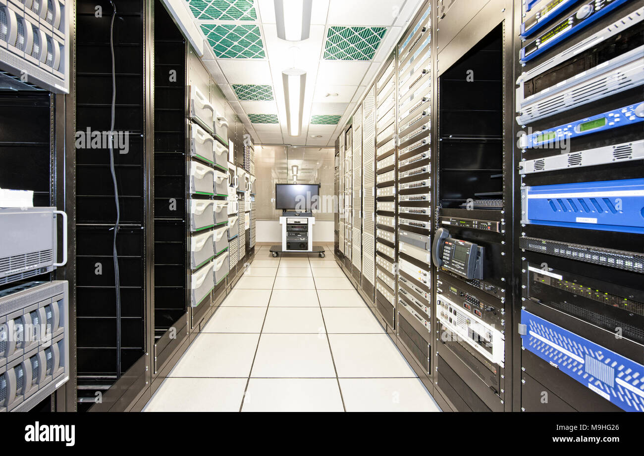 Storage racks aligned in a computer server room Stock Photo - Alamy