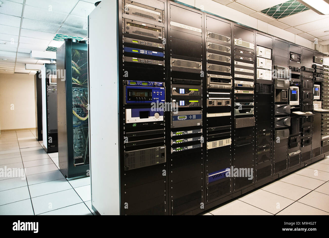 Storage racks aligned in a computer server room Stock Photo - Alamy