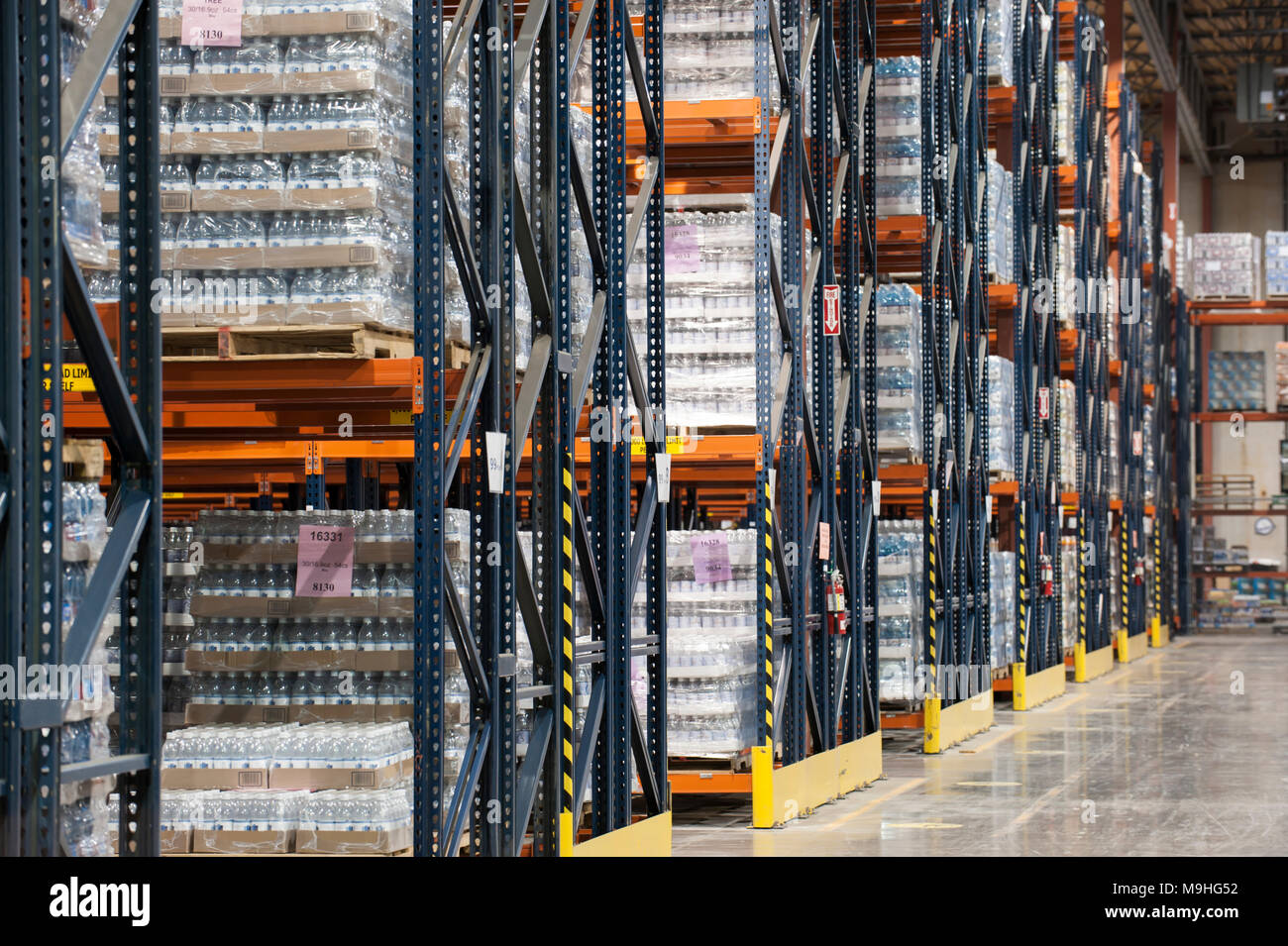 Interior of a warehouse showing flavored bottled water stored on ...