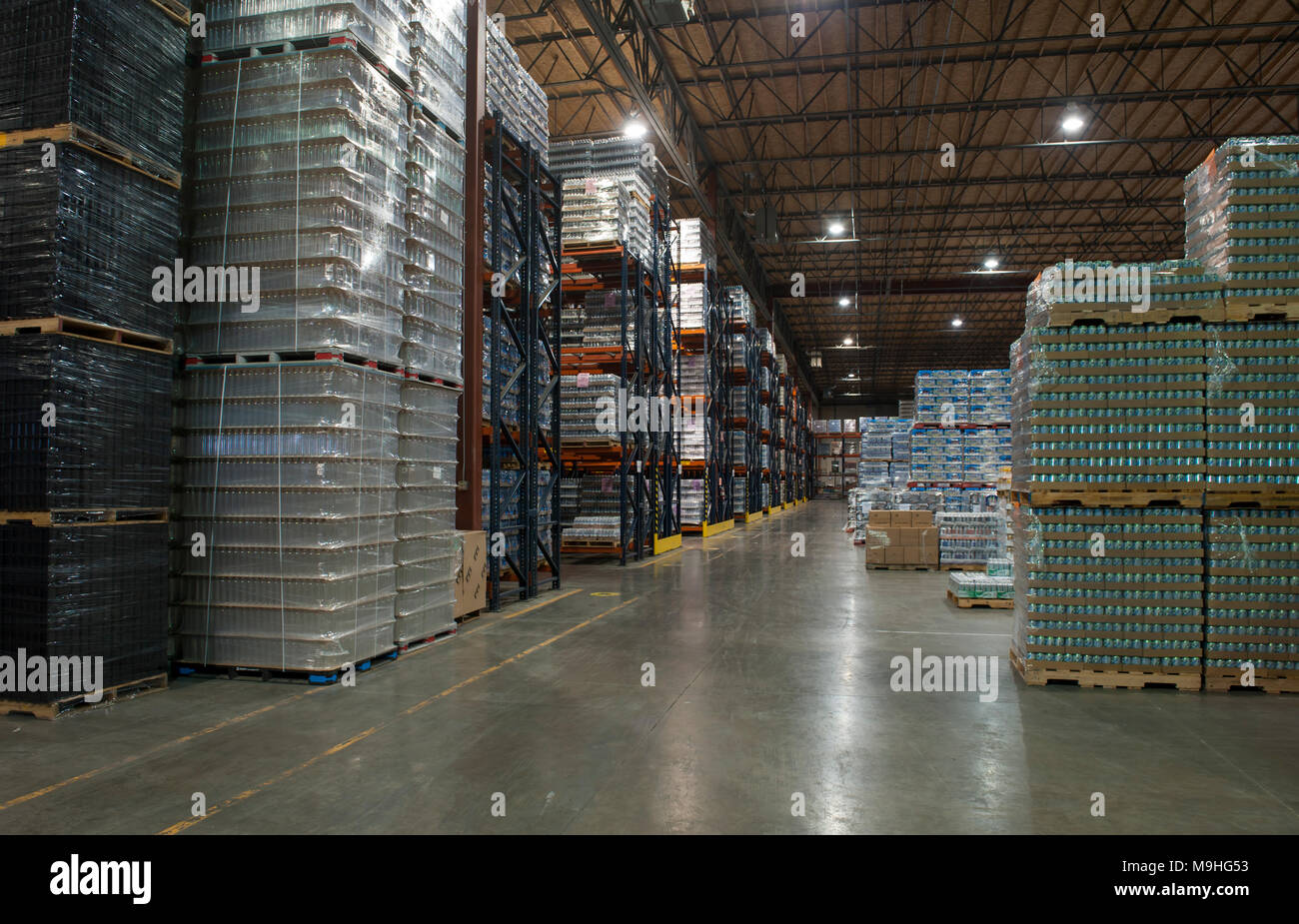 Interior of a warehouse showing flavored bottled water stored on ...