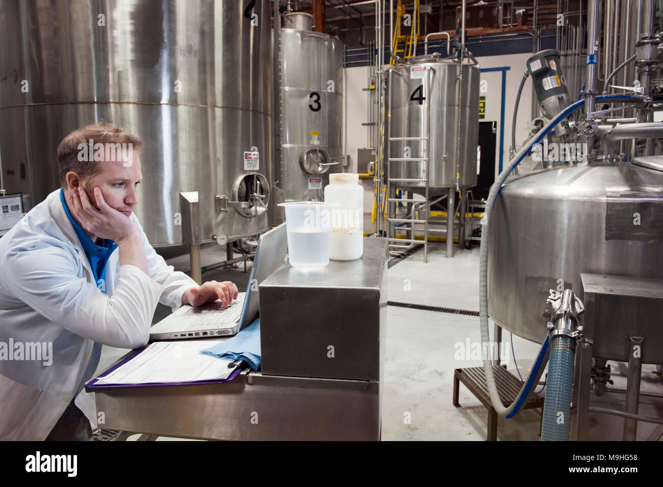 Worker checking tanks bottling hi-res stock photography and images - Alamy