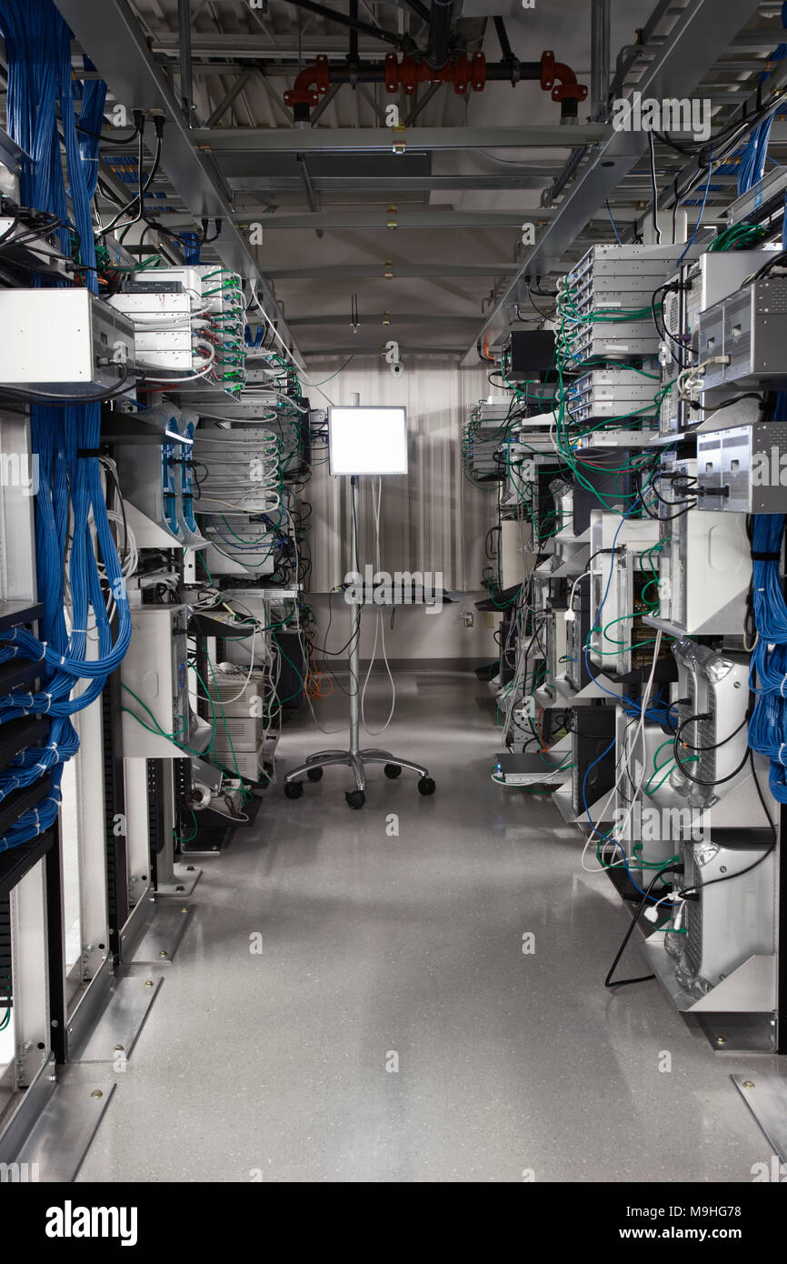 Computer server towers in racks in a computer server farm Stock Photo ...
