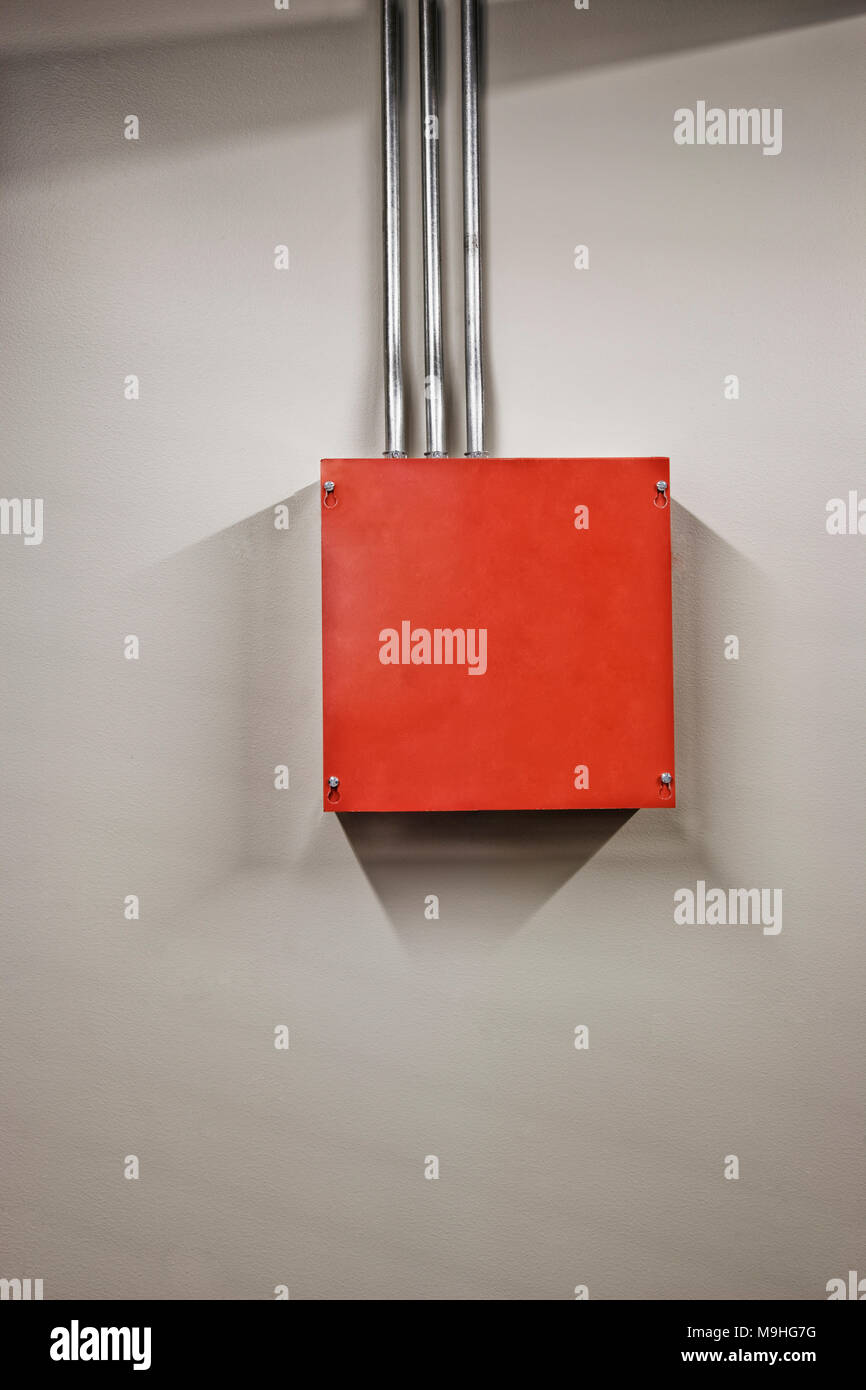 A red metal power junction box in a computer server farm Stock Photo ...