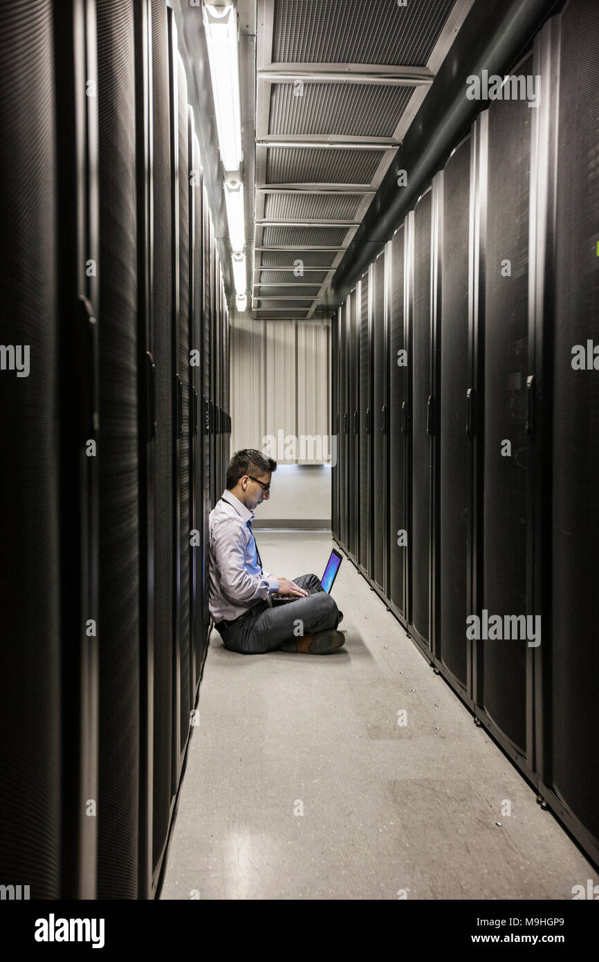 Technician sitting on floor hi-res stock photography and images - Alamy