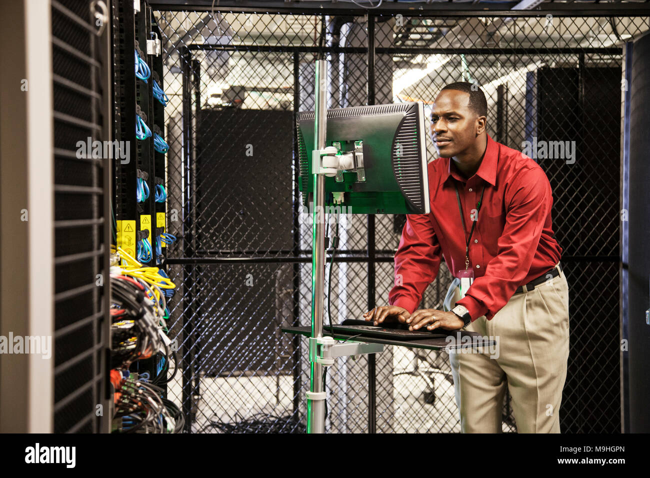 Black male server room hi-res stock photography and images - Alamy