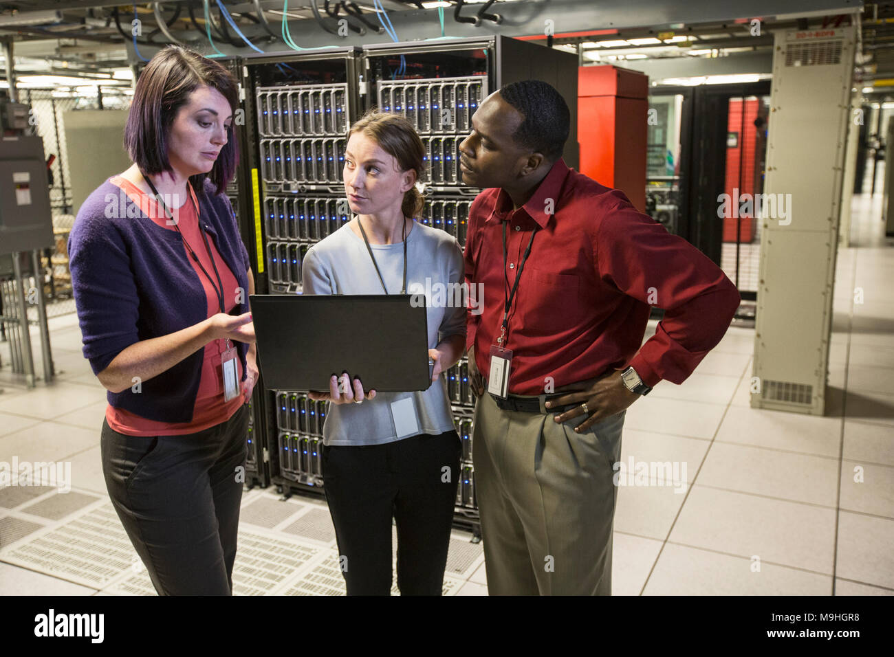 Technicians talking in server room hi-res stock photography and images ...