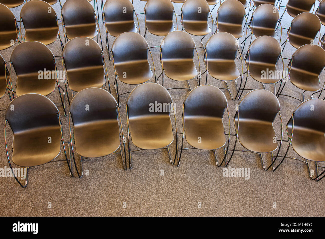 Folding chairs lined up for a business meeting Stock Photo - Alamy