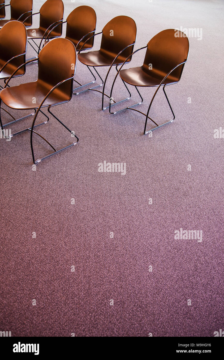 Folding chairs lined up for a business meeting Stock Photo - Alamy