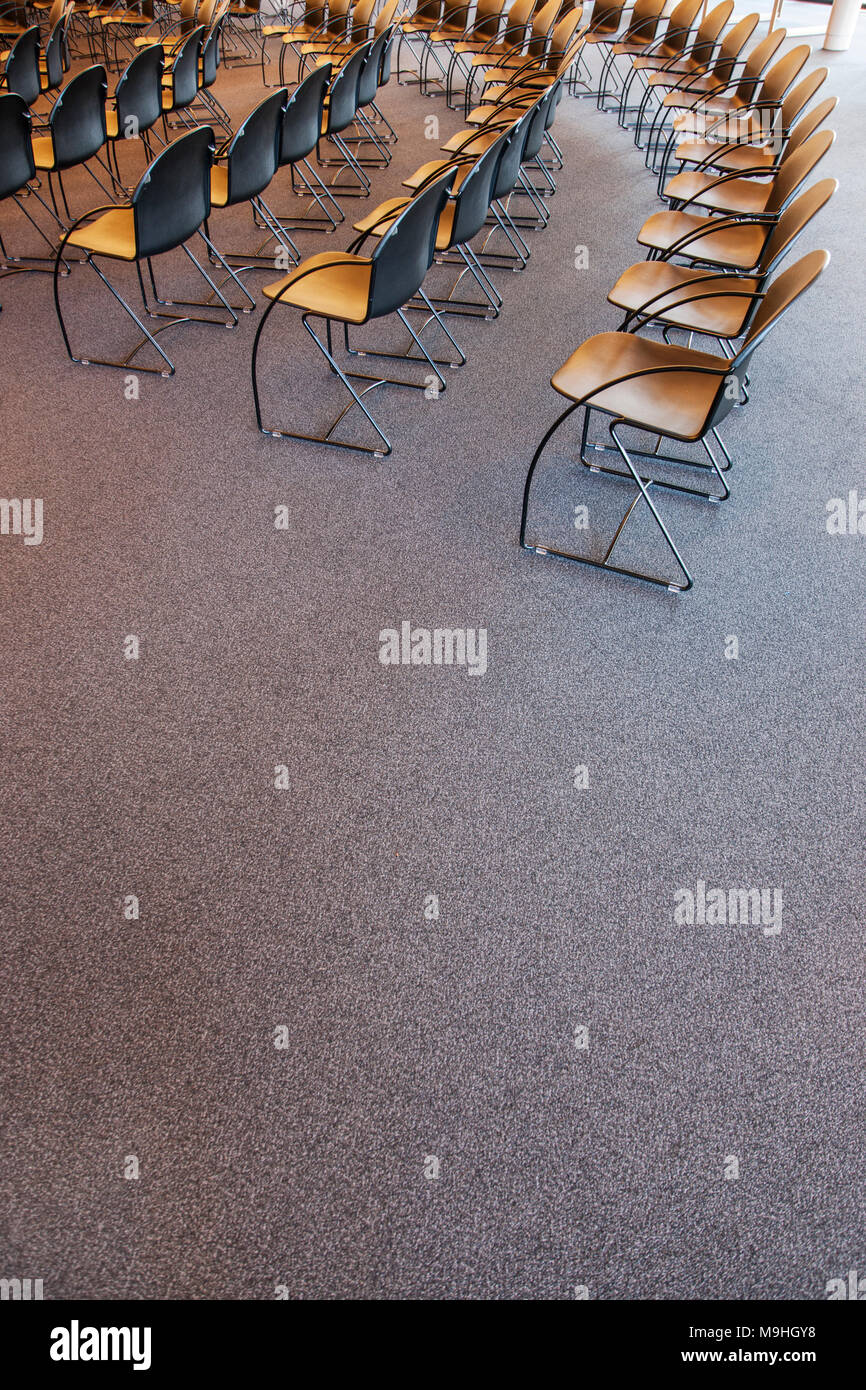 Folding chairs lined up for a business meeting Stock Photo - Alamy