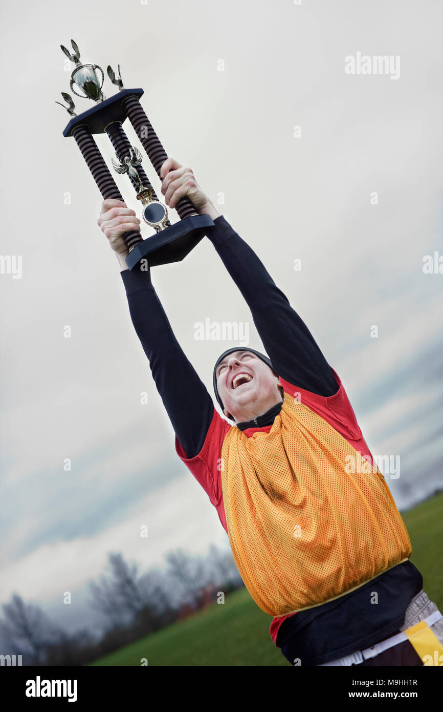 Football celebrating trophy arms raised hi-res stock photography and ...