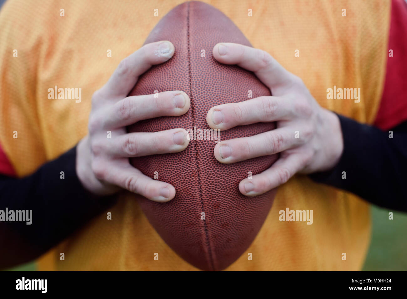 Holding footballs hi-res stock photography and images - Alamy