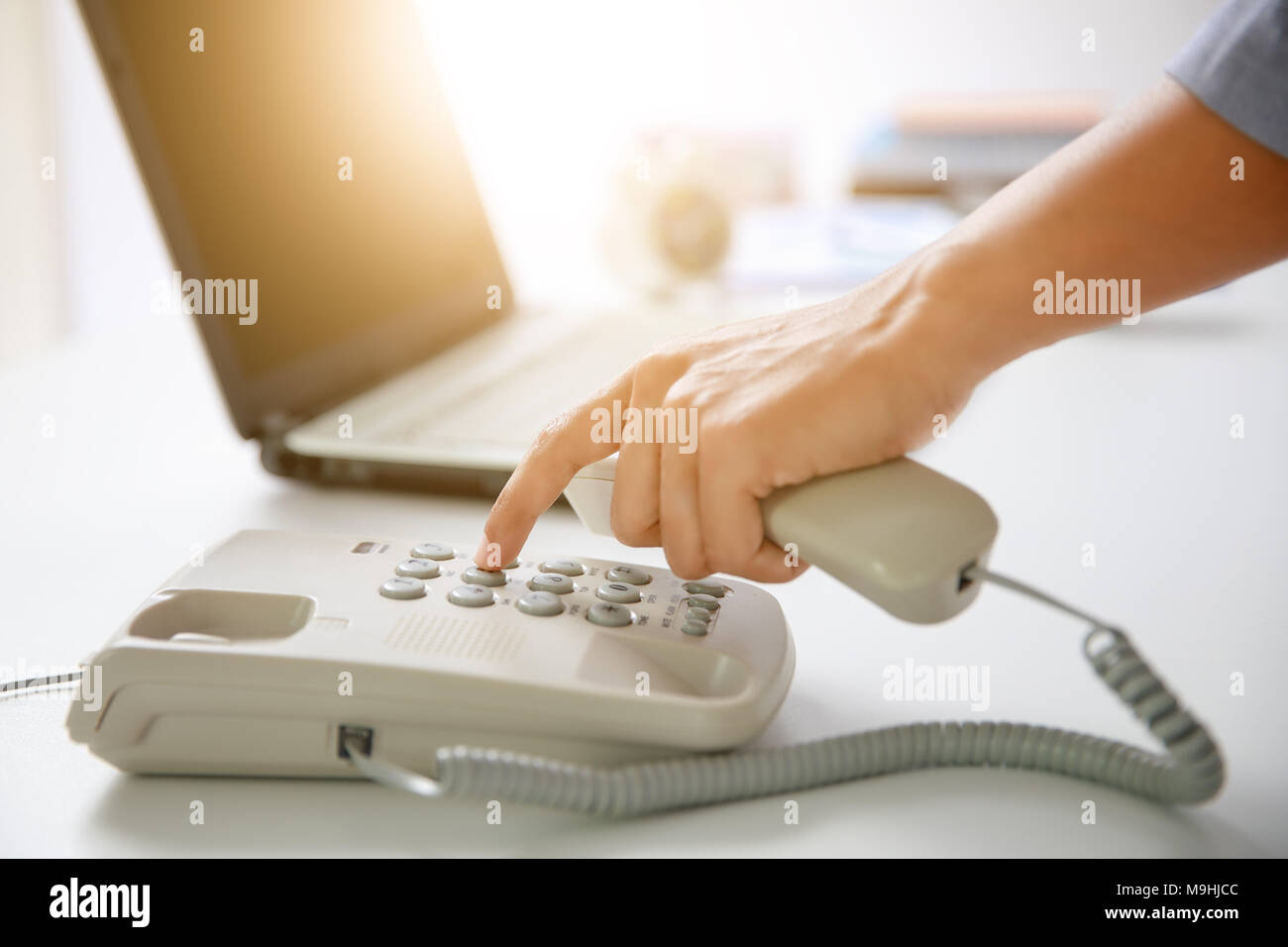businessman dial digital telephone with office background Stock Photo ...