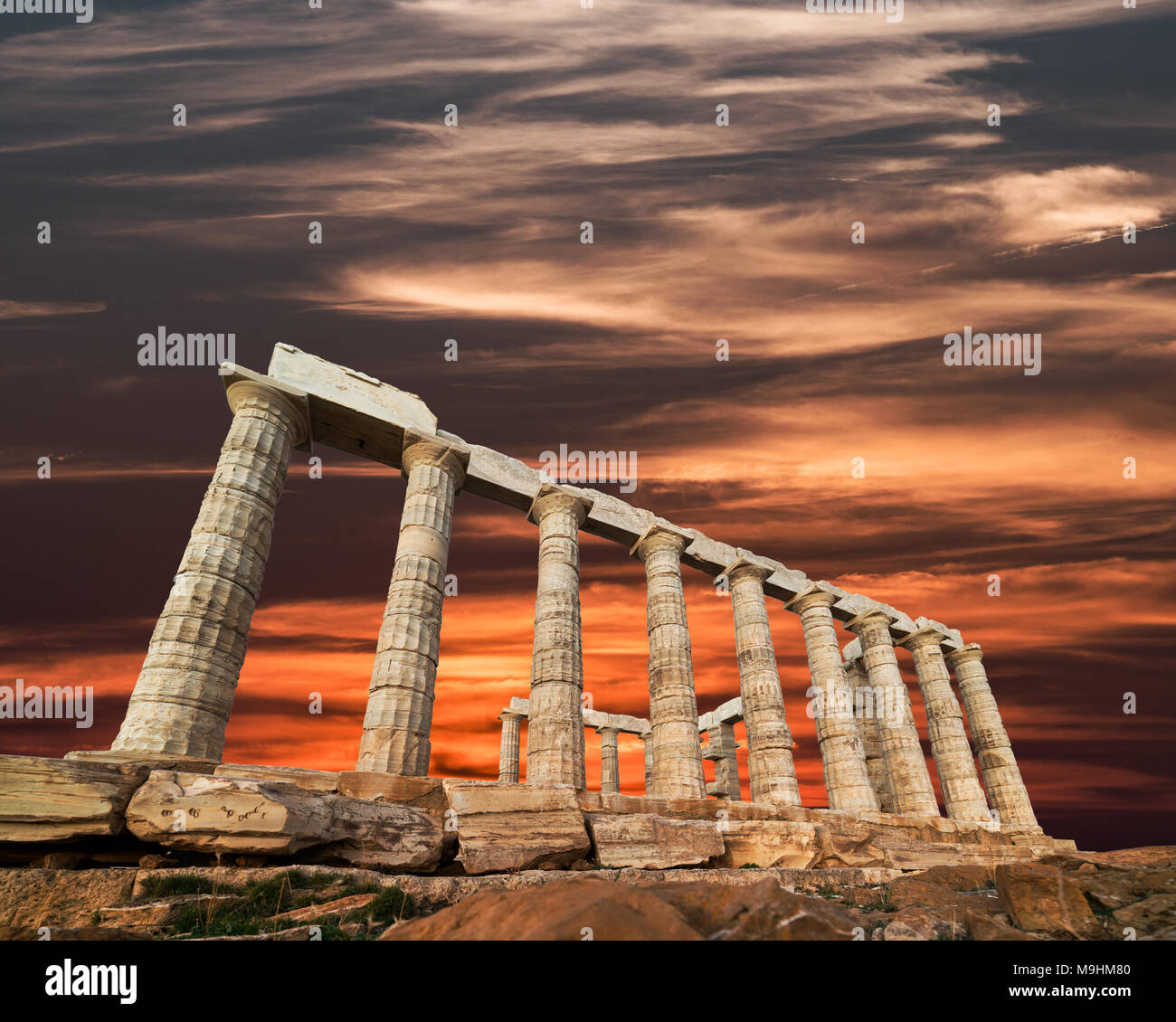 Ruins of the temple of Poseidon at Cape Sounio, sunset colors sky ...