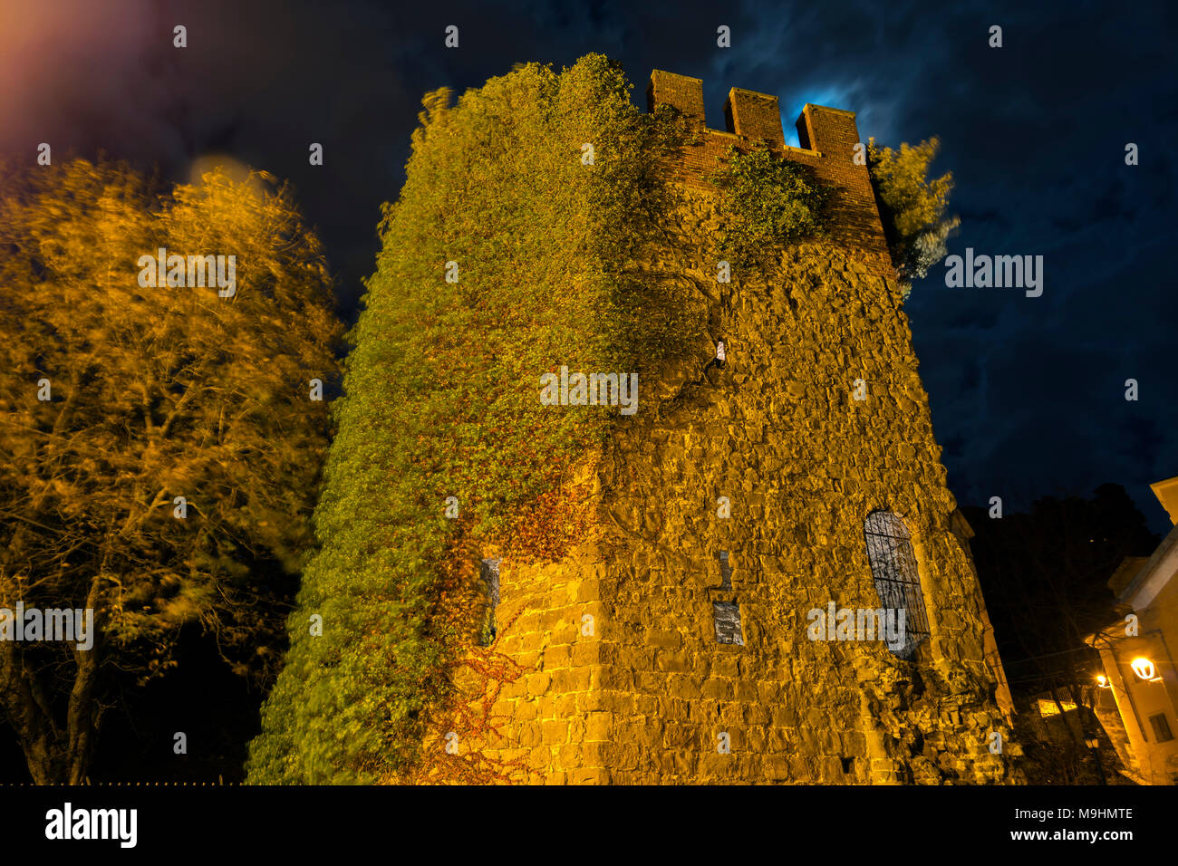 ancient Cucherna tower in Trieste by night Stock Photo - Alamy