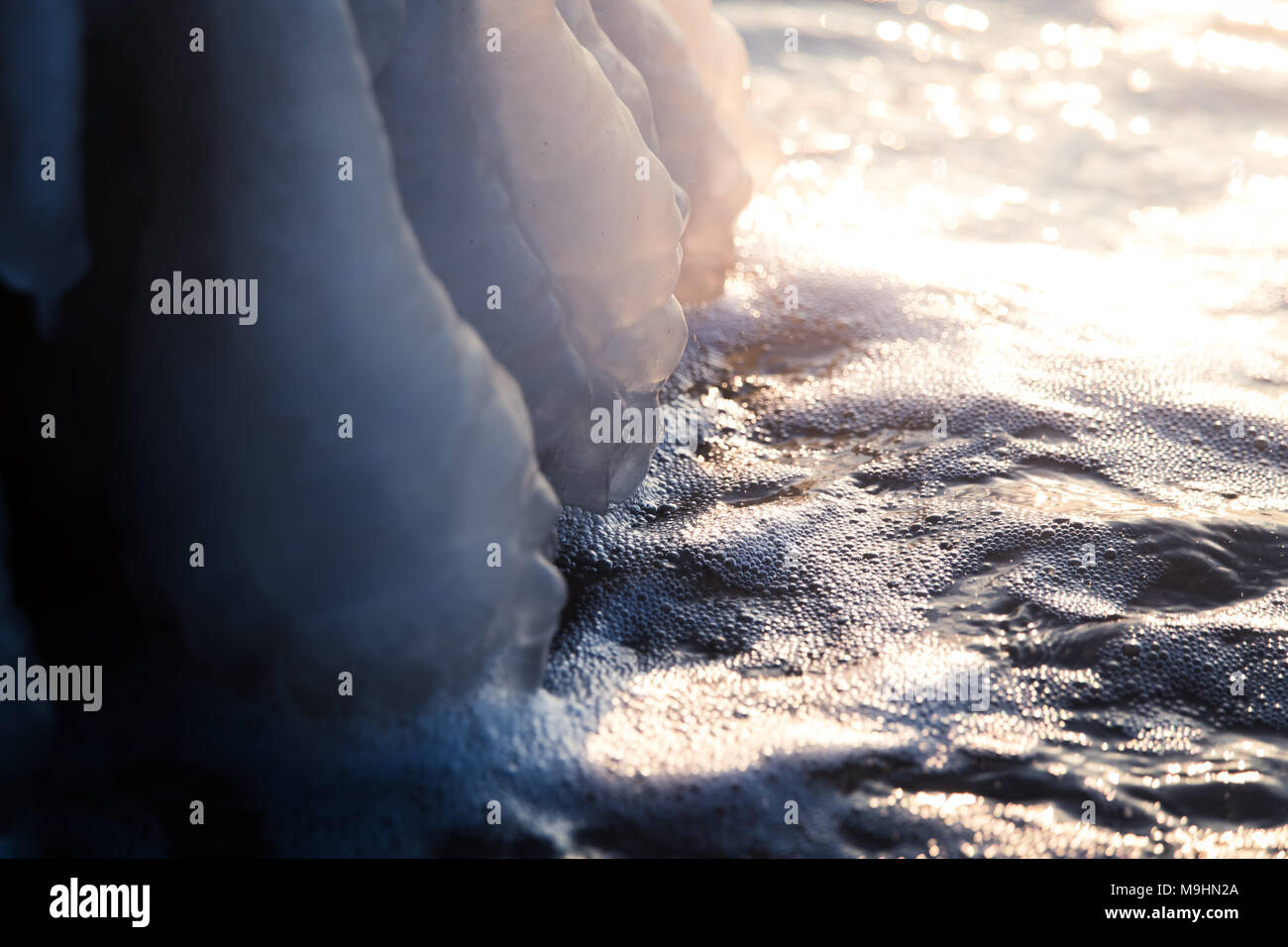 A beautiful frozen salt water on the beach of Baltic sea. Ice ...