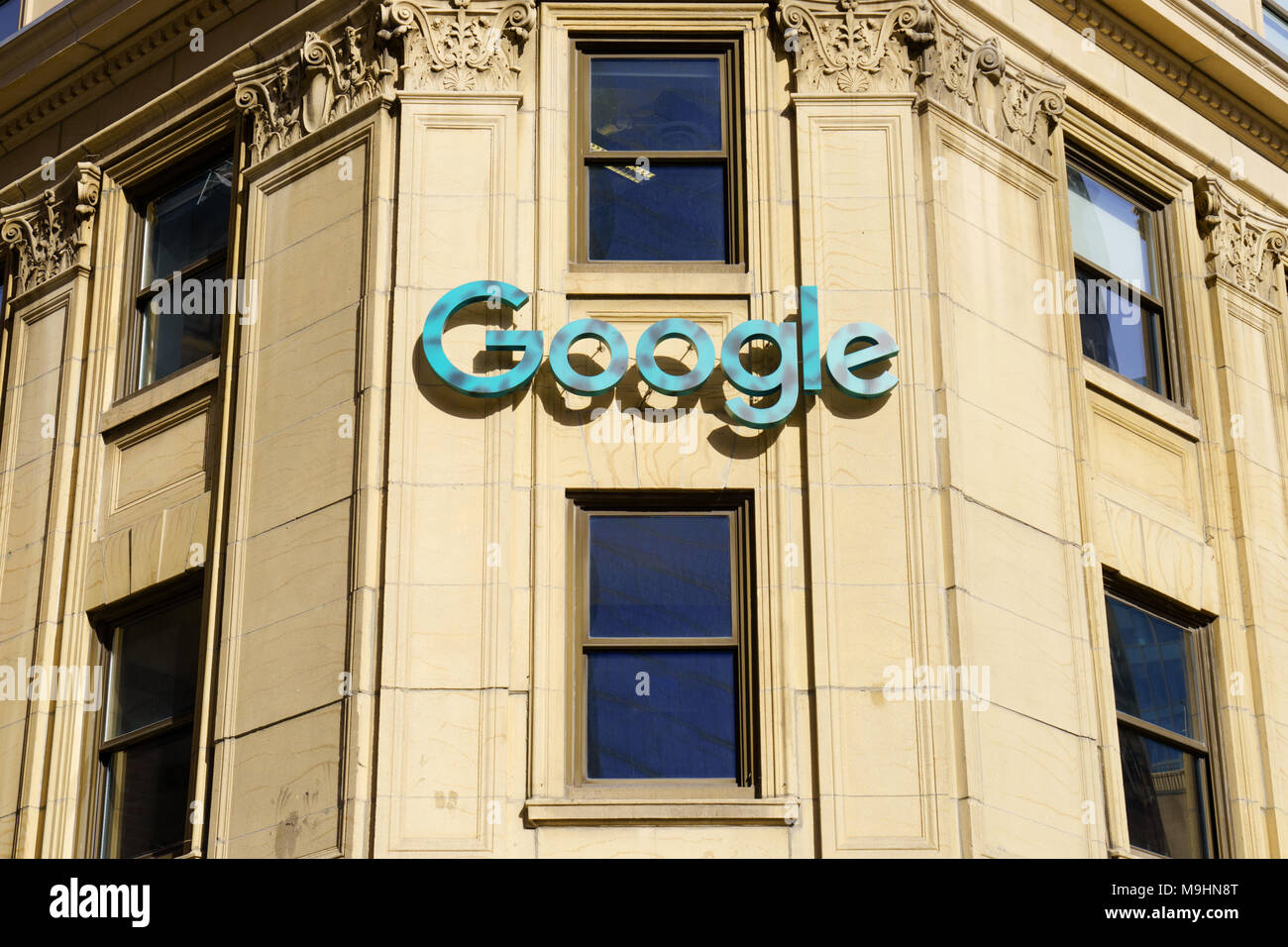 Green Google logo on the facade of the company's headquarters in ...