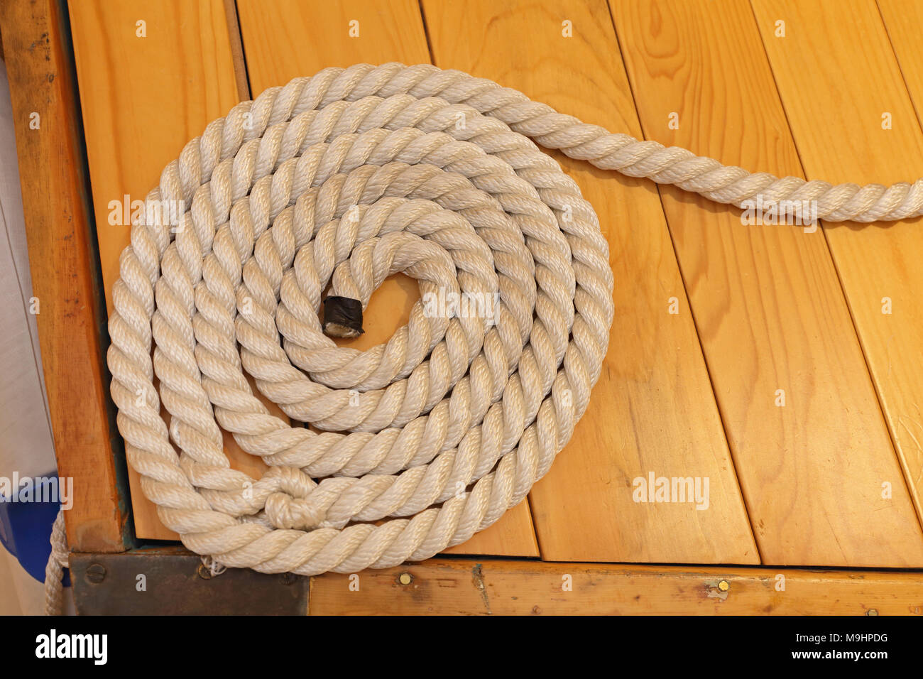 Coil of Rope at Wooden Boat Deck Stock Photo - Alamy