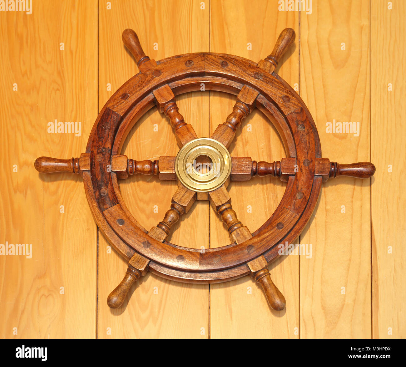 Retro Style Wooden Ship Steering Wheel at Deck Stock Photo - Alamy