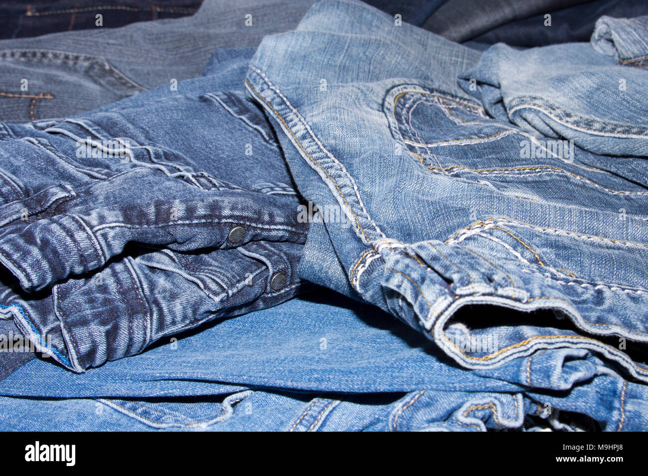 Pile of jeans ready for recycling Stock Photo - Alamy