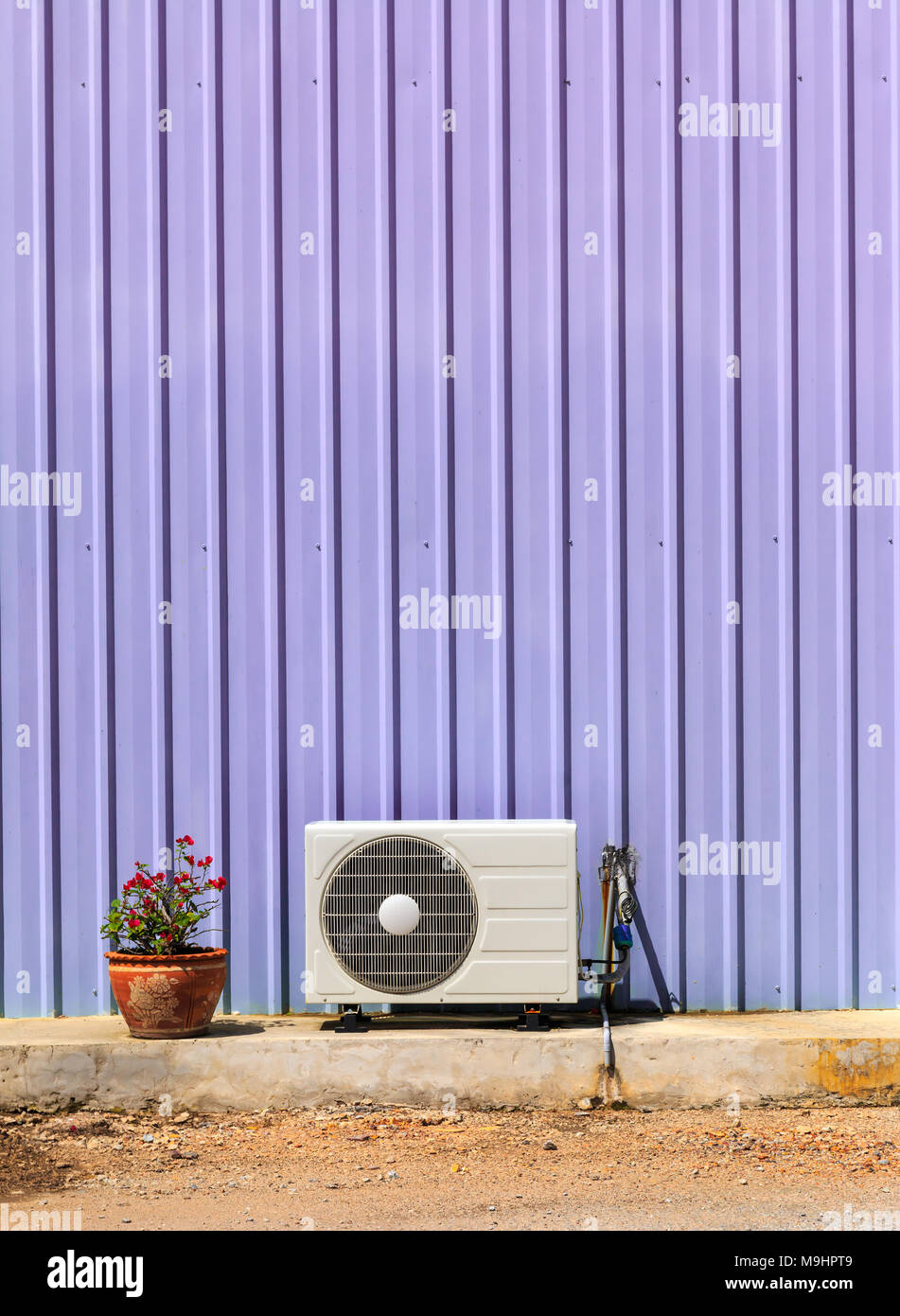 Old compressor air-conditioner and Flower Pot on zinc wall Stock Photo ...
