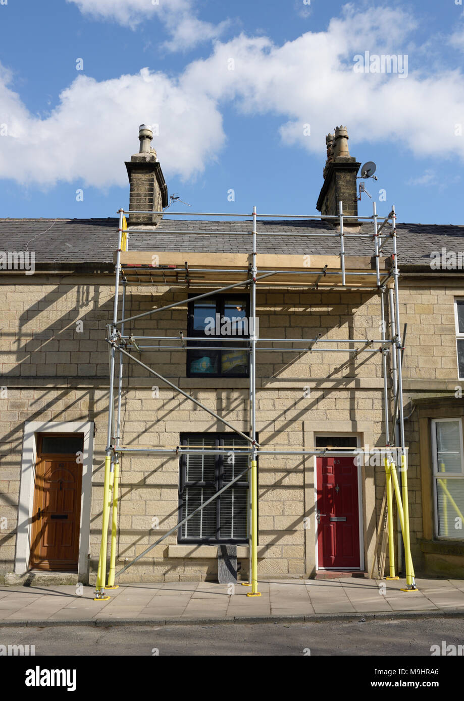 Stone terrace houses with scaffolding outside Ramsbottom lancashire uk ...